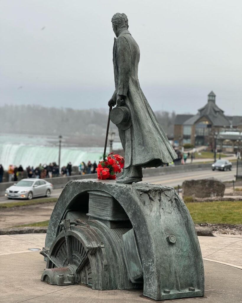 Nikola Tesla's statue overlooking Niagara Falls - ECG Productions